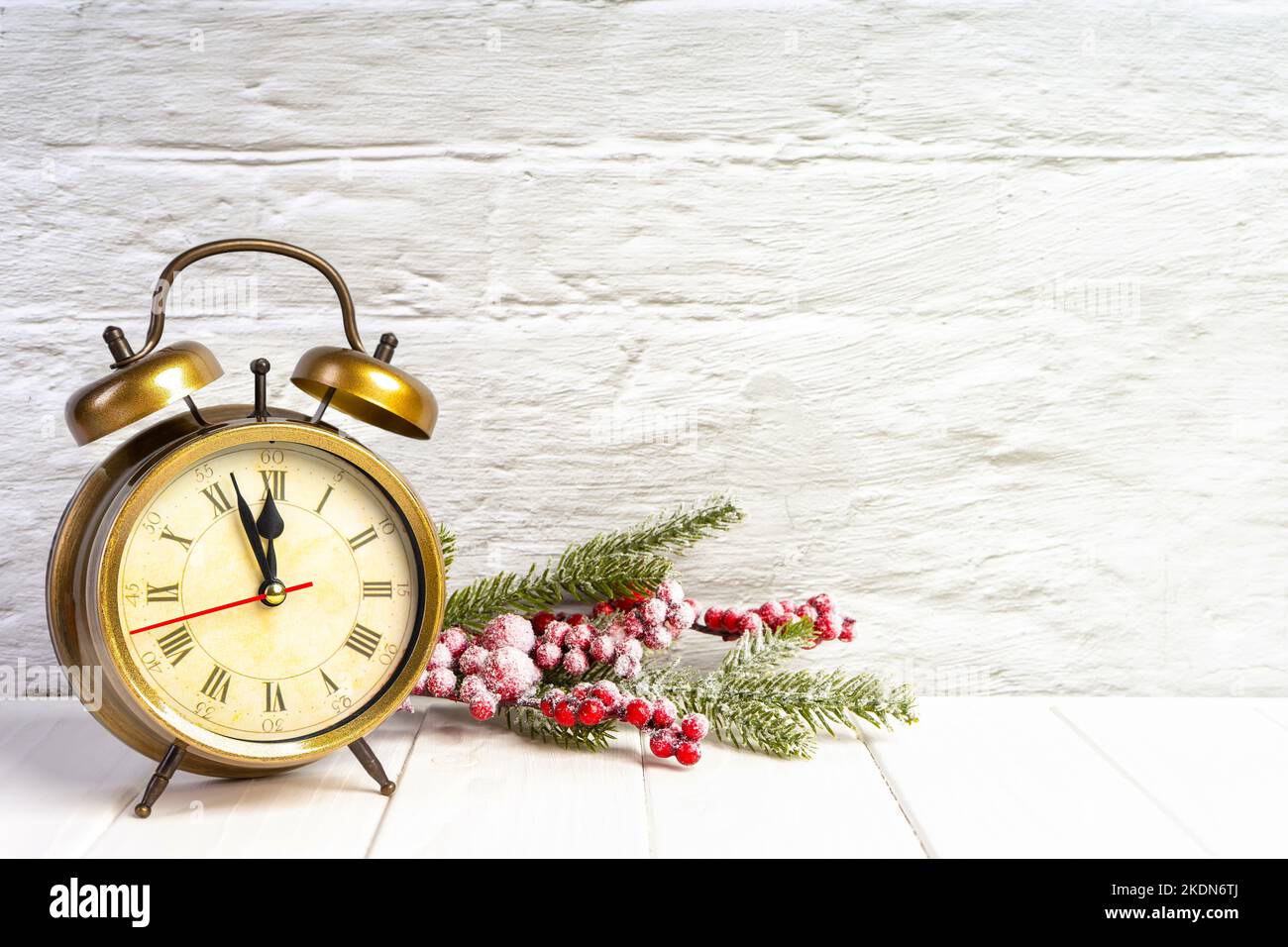 Decorative Christmas tree and bronze alarm clock countdown to midnight ...