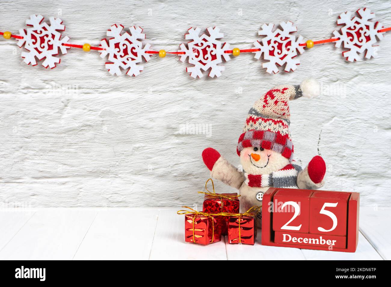 Decorative Christmas snowman, gift boxes and red wooden perpetual ...