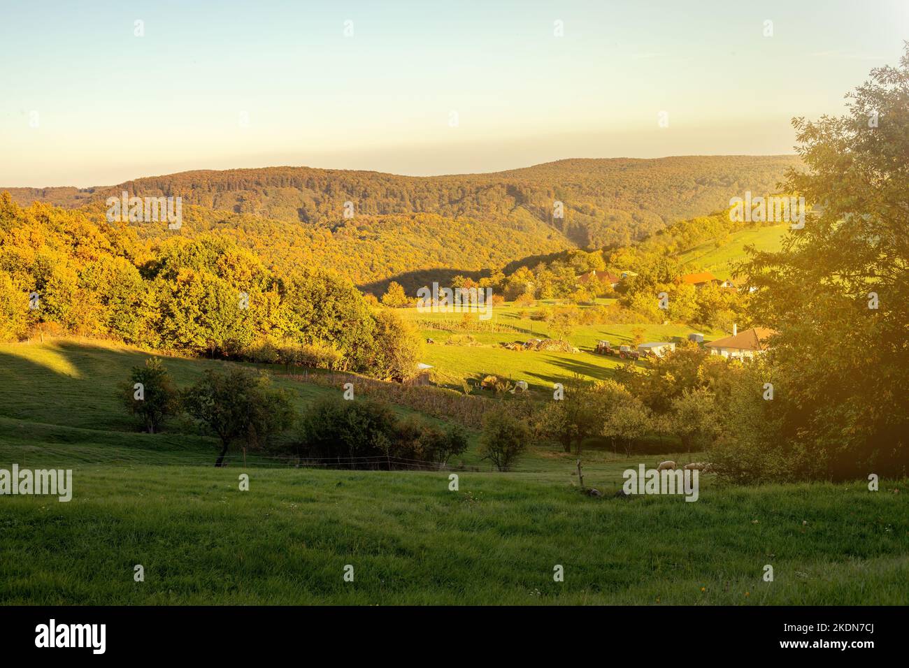Hilly landscape with distant village hi-res stock photography and ...