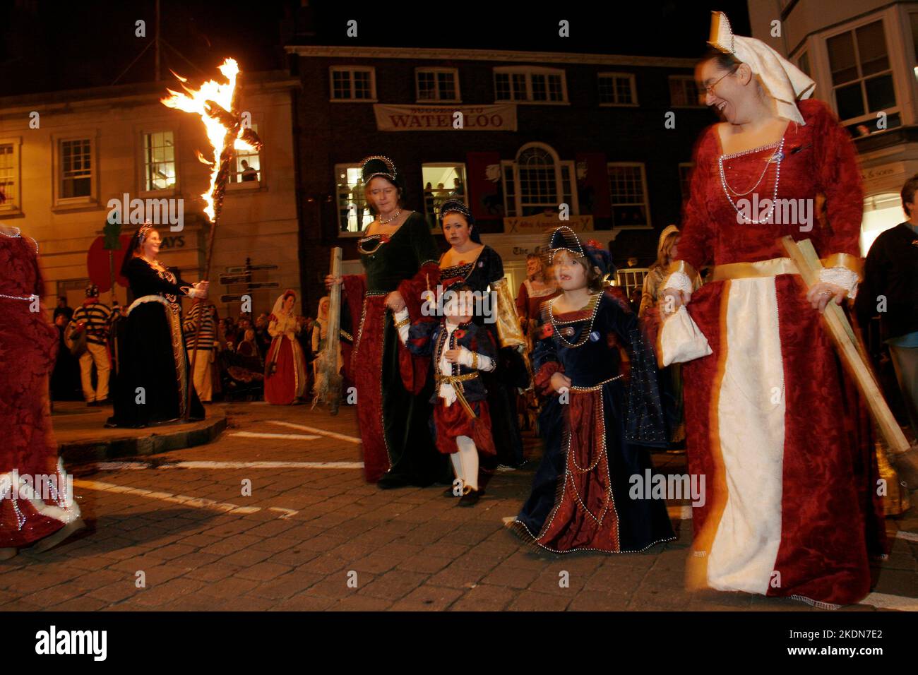 Tudor mothers and children move past the war memorial after laying a ...