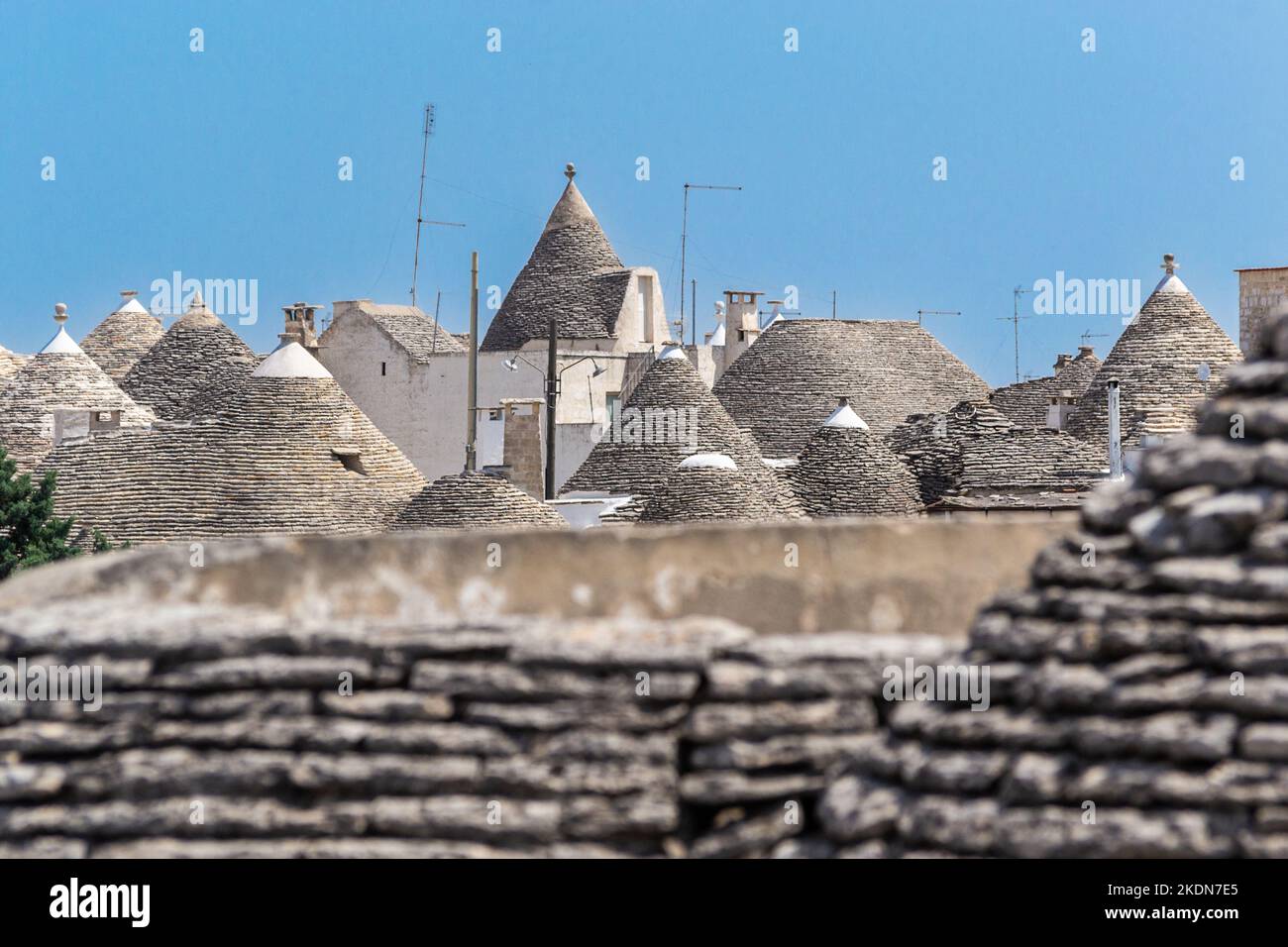 Unique white buildings with conical roof called "Trulli" in Alberobello ...