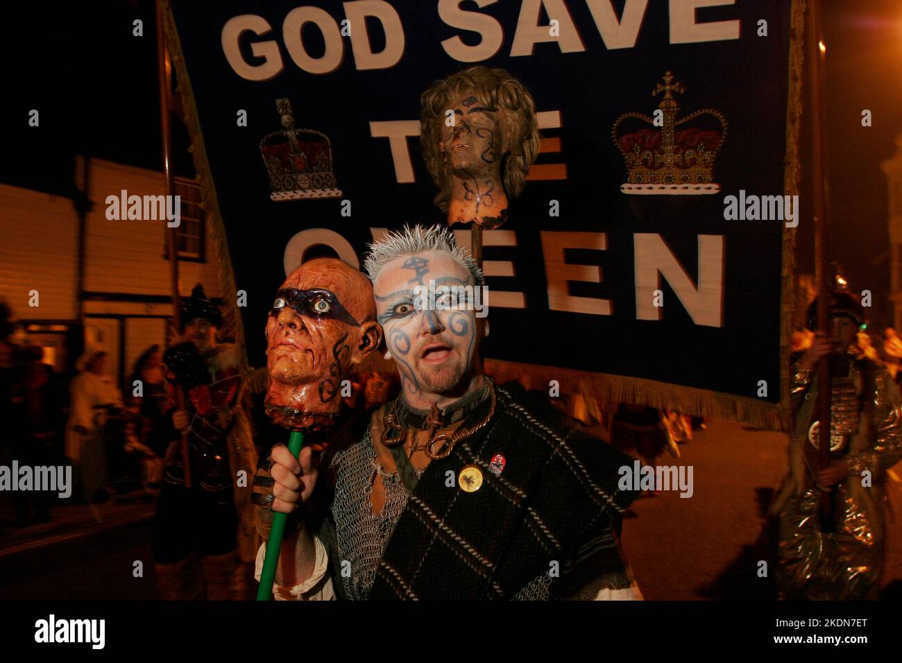 Part of the Waterloo Bonfire Society procession, this man carries two ...