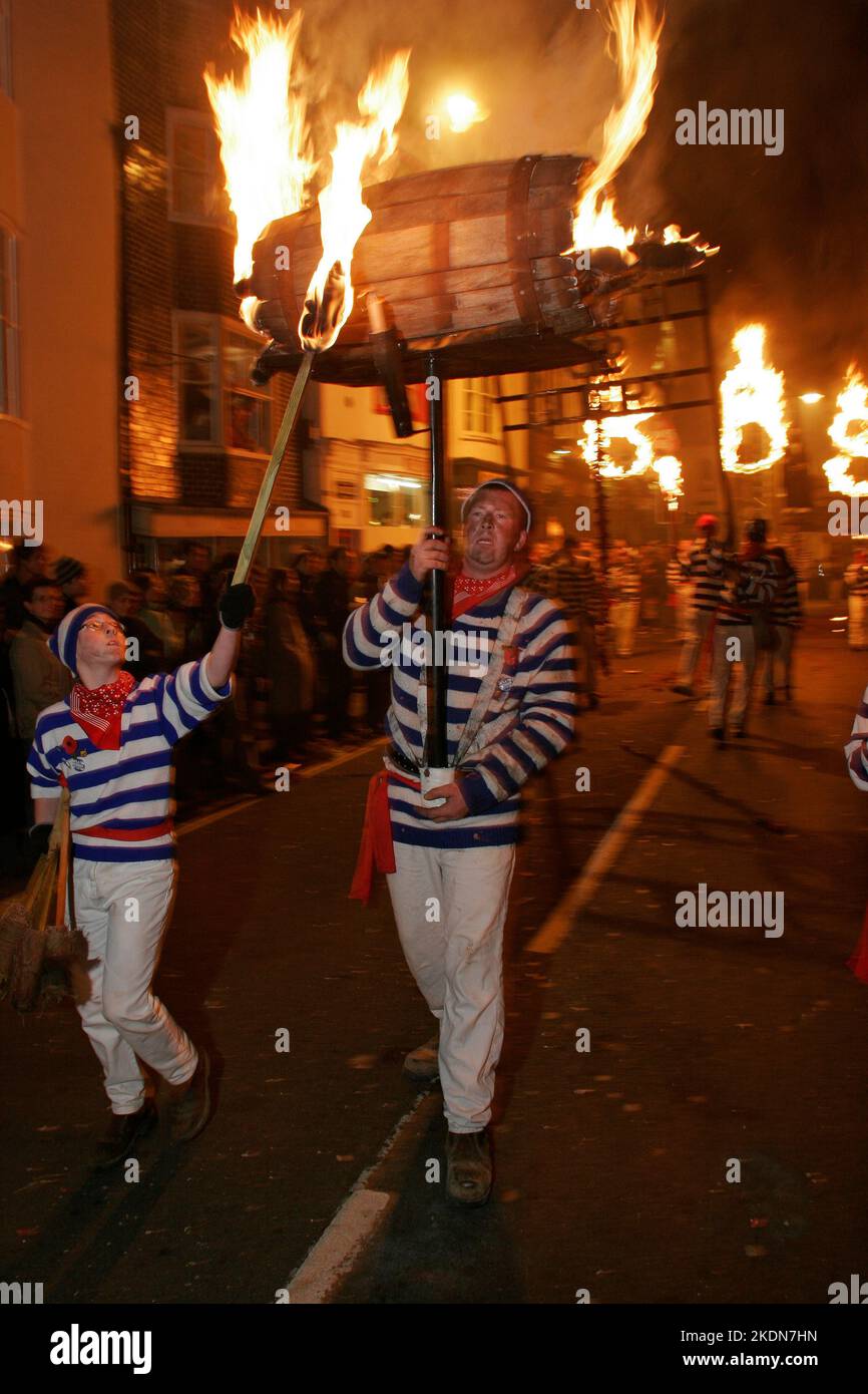 Jason Winter, Captain of Tar Barrels for Borough, carries a flaming ...
