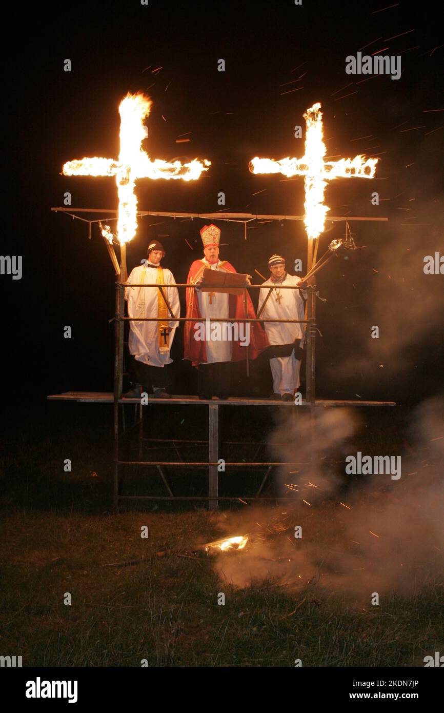 The "Archbishop" and "clergy" address the crowd, drowned out by the ...