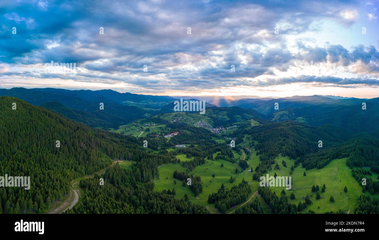 Valley of Balkan mountains is covered with fog, sunny clouds and ...