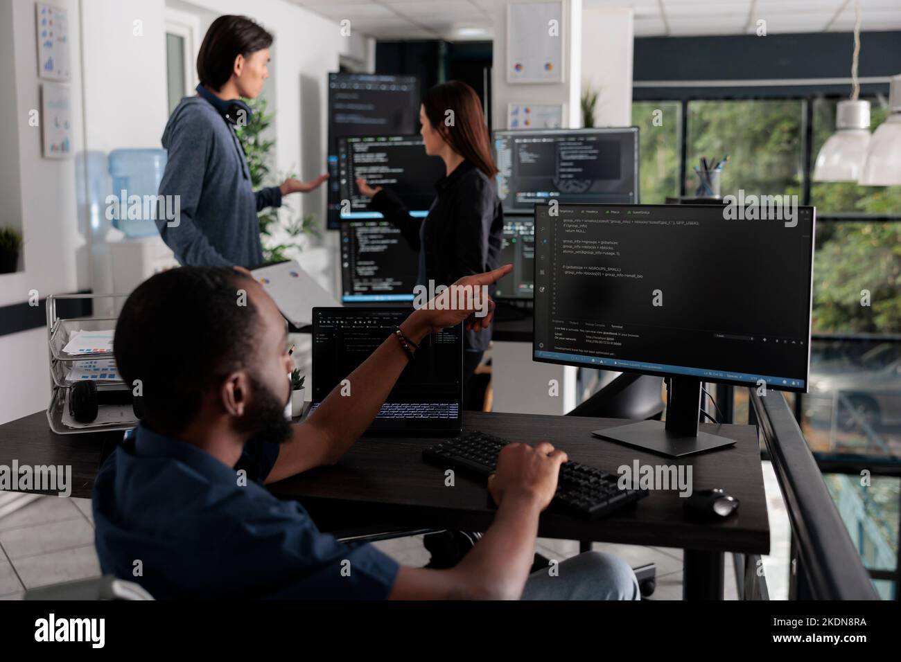 African American Web Developer In Wheelchair Looking At Programming Language Typing Script On