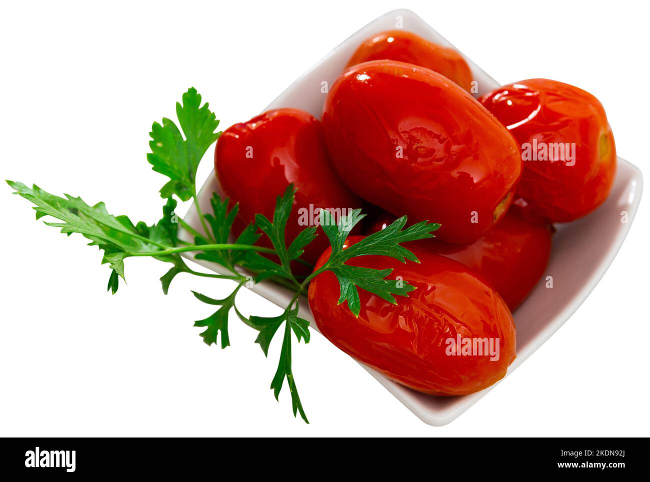 White salad bowl with pickled tomatoes on table Stock Photo - Alamy