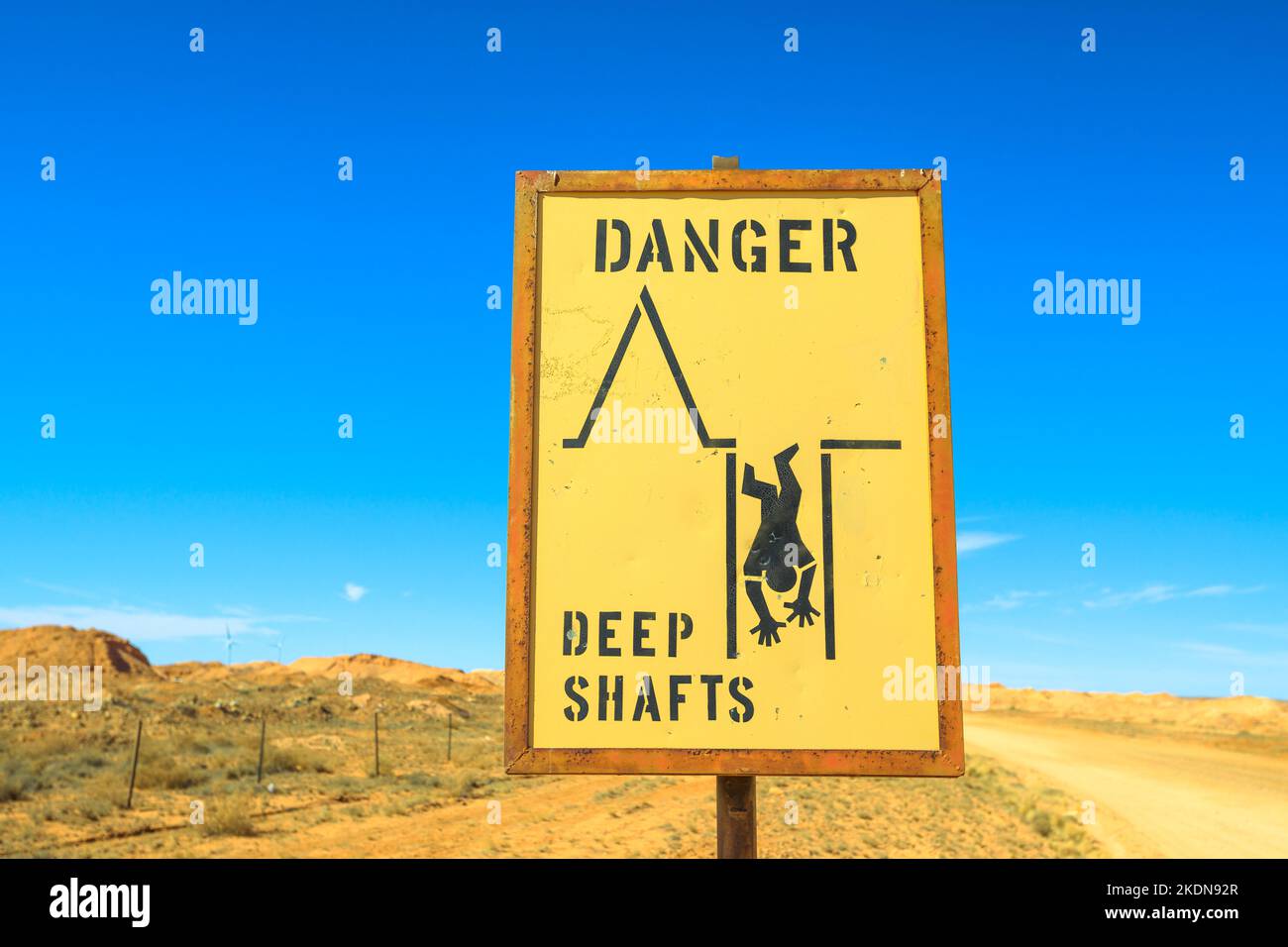 Close up of danger cave deep shafts road sign in Coober Pedy ...