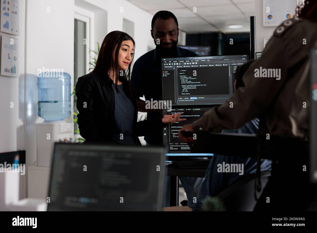 Multi Ethnic Programmers Checking Source Code And Database Brainstorming Ideas To Develop New