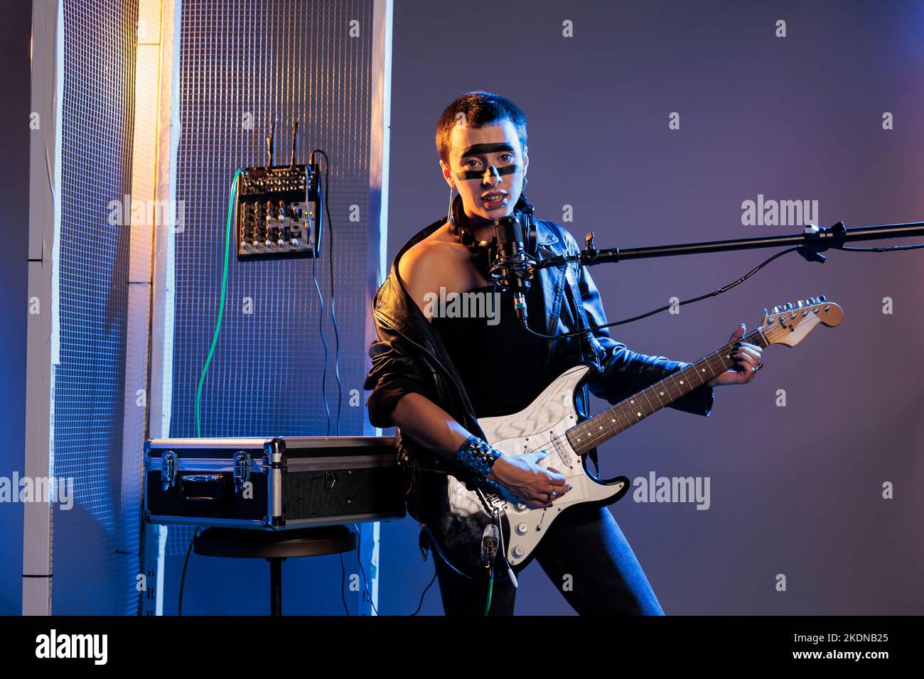 Crazy alternative rock singer performing live in studio with dark ...