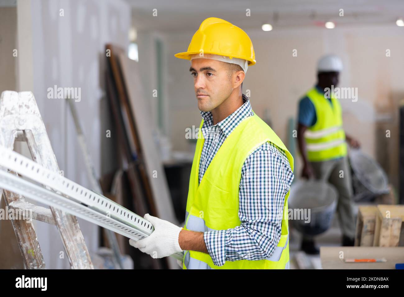 Repairman working in construction site in apartment Stock Photo - Alamy