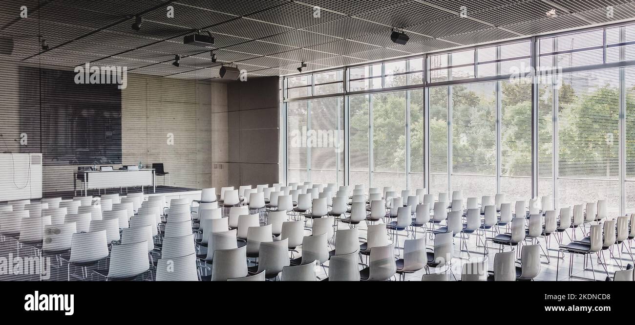 Interior of empty contemporary conference hall with white chairs Stock ...