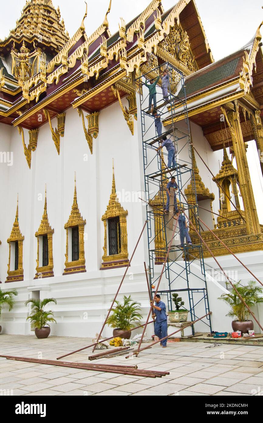 Bangkok, Thailand - December 26, 2007: working men on a rack at the ...