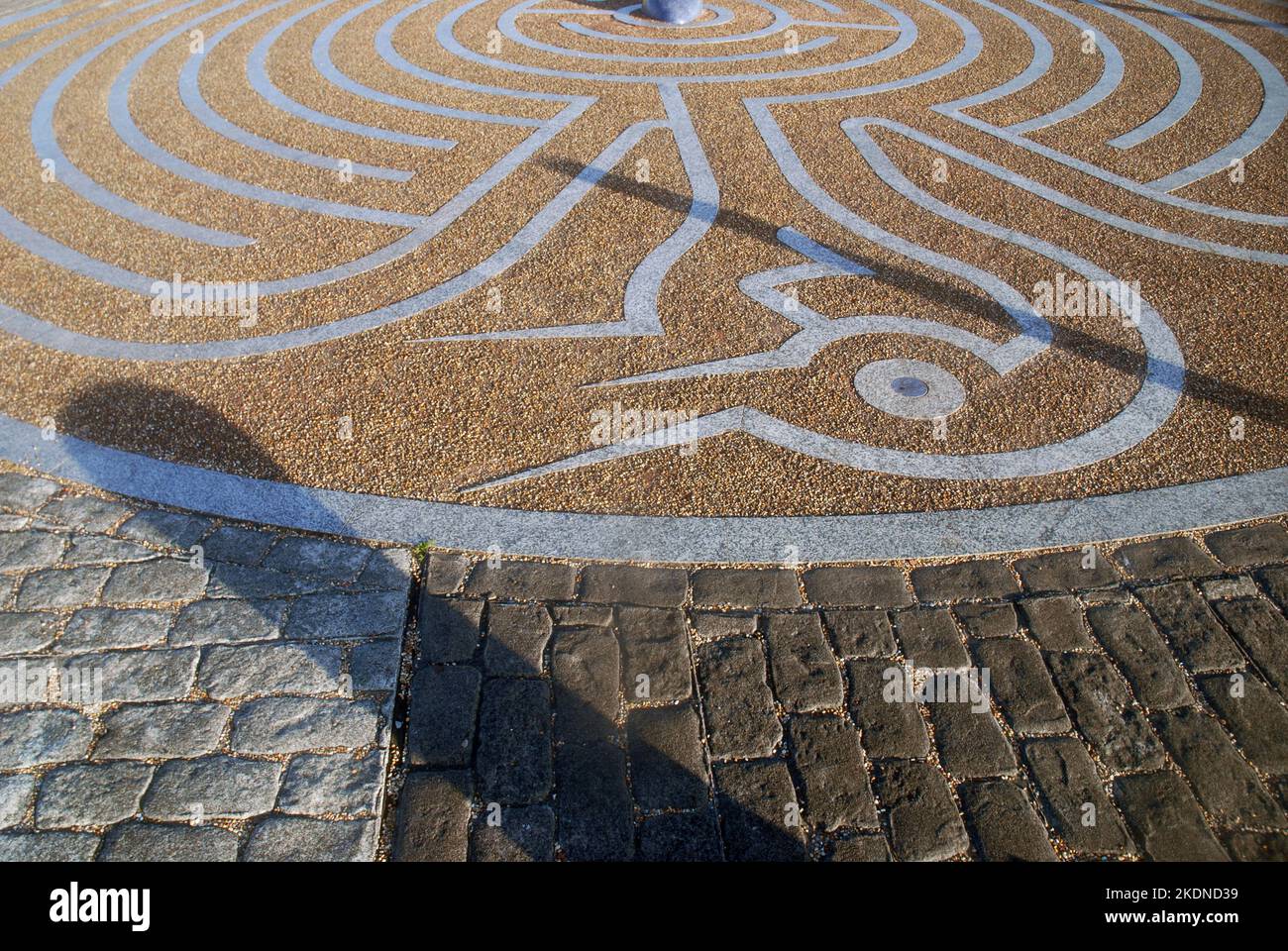 Motif of bird on pavement, Morecambe bay and the promenade, Lancashire ...