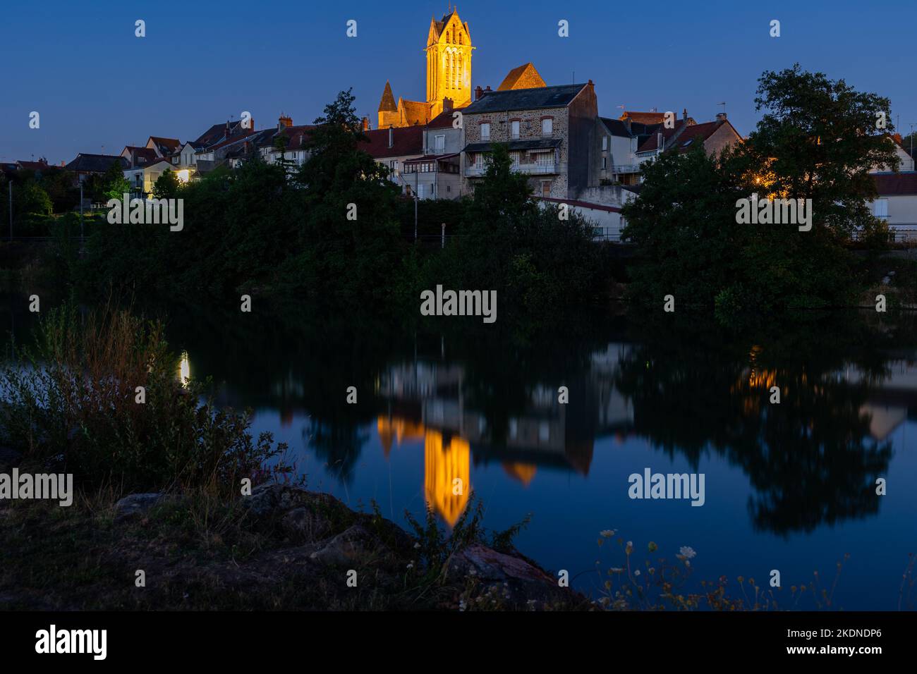 Evening view of Dormans townscape with bell tower of Saint-Hippolyte ...