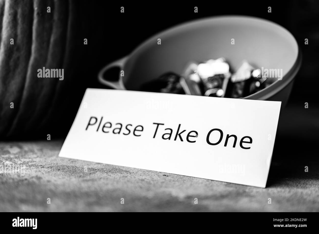 Bowl sitting on a doorway with a sign stating to please take one for ...