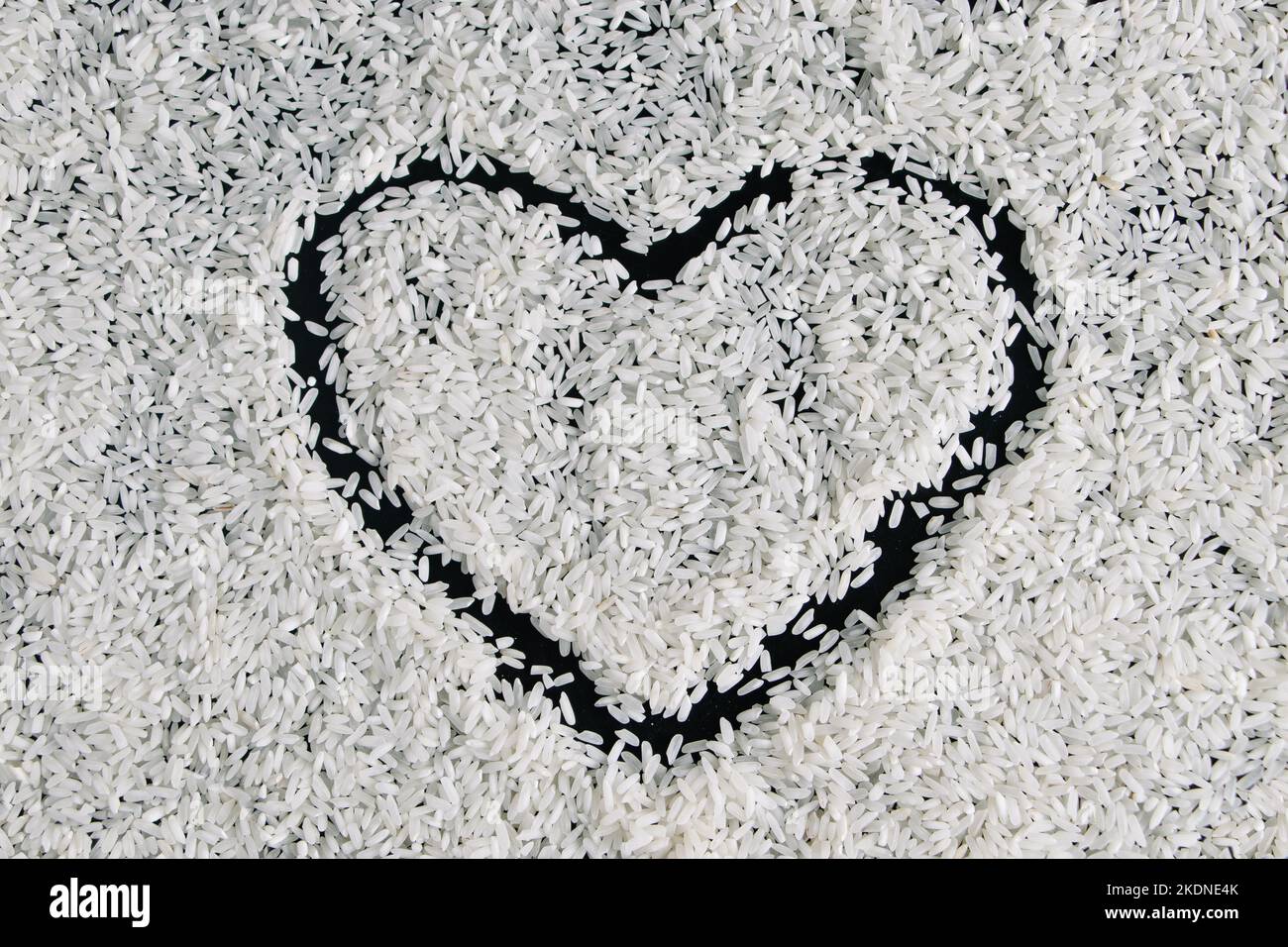 Heart-shaped rice on dark background. Love and valentines day concept ...