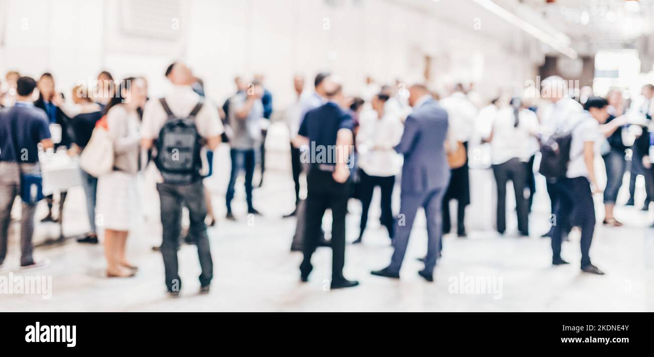 Abstract blurred people socializing during coffee break at business ...
