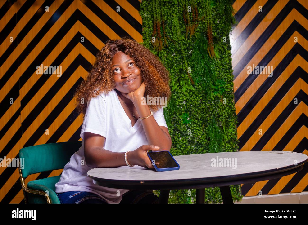 beautiful excited lady feeling excited in a cafe Stock Photo - Alamy
