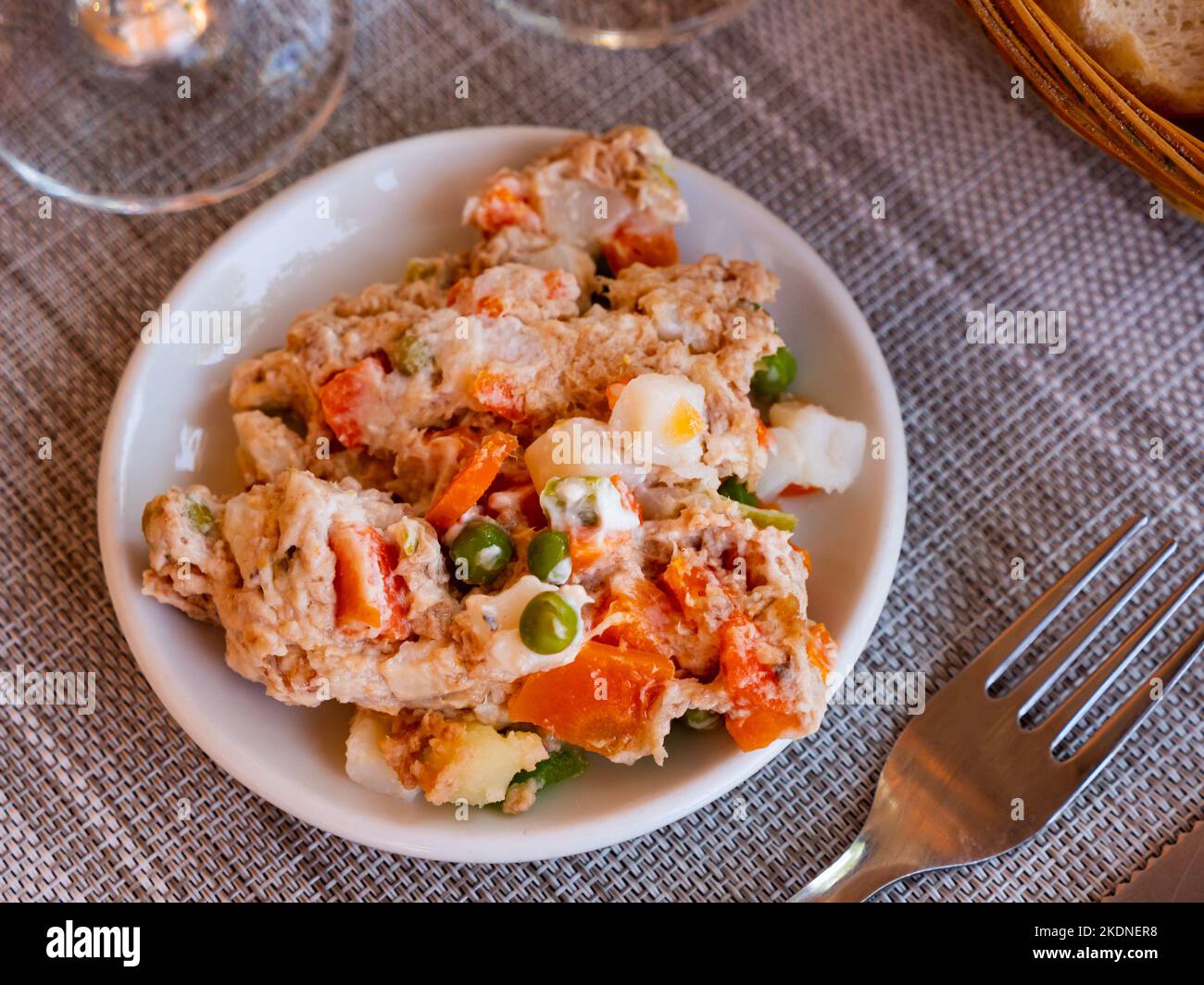 Banquet in restaurant - Spanish salad with potatoes, tuna, olives and ...