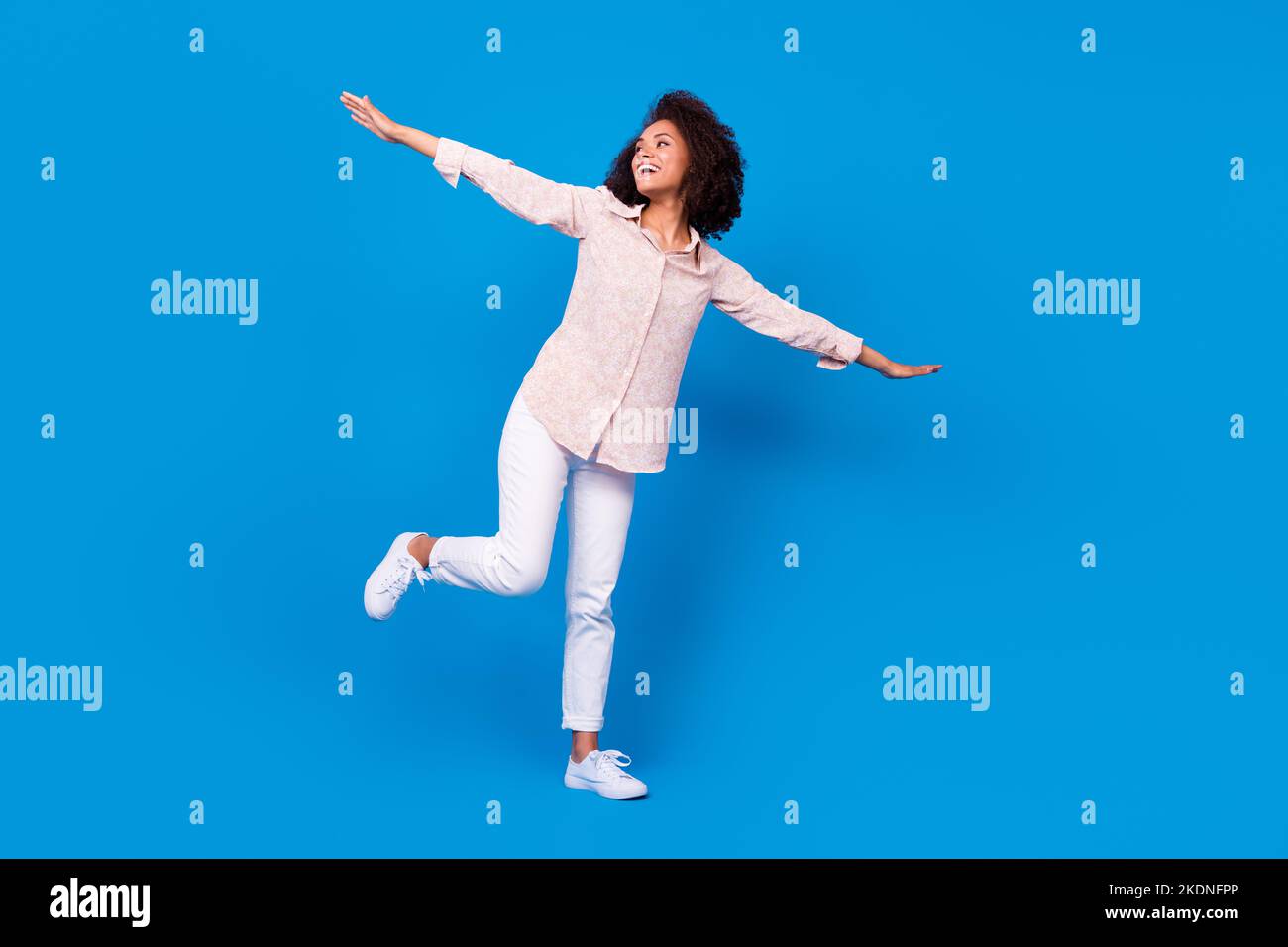 Full body portrait of positive dreamy girl hands wings flying toothy ...