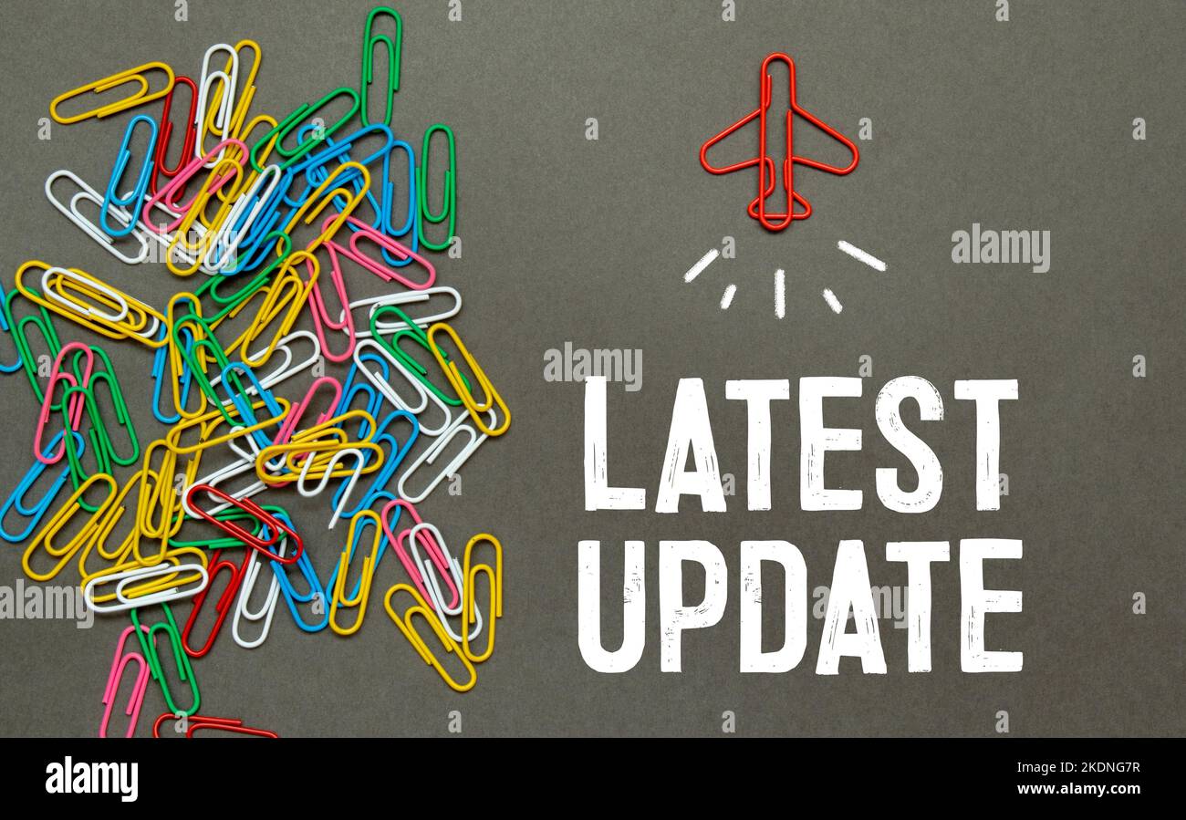 Text LATEST UPDATE made of wooden cubes on beige background Stock Photo ...