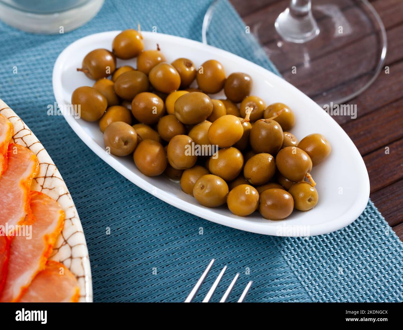Pickled olives with a stone - a typical Spanish tapas Stock Photo - Alamy