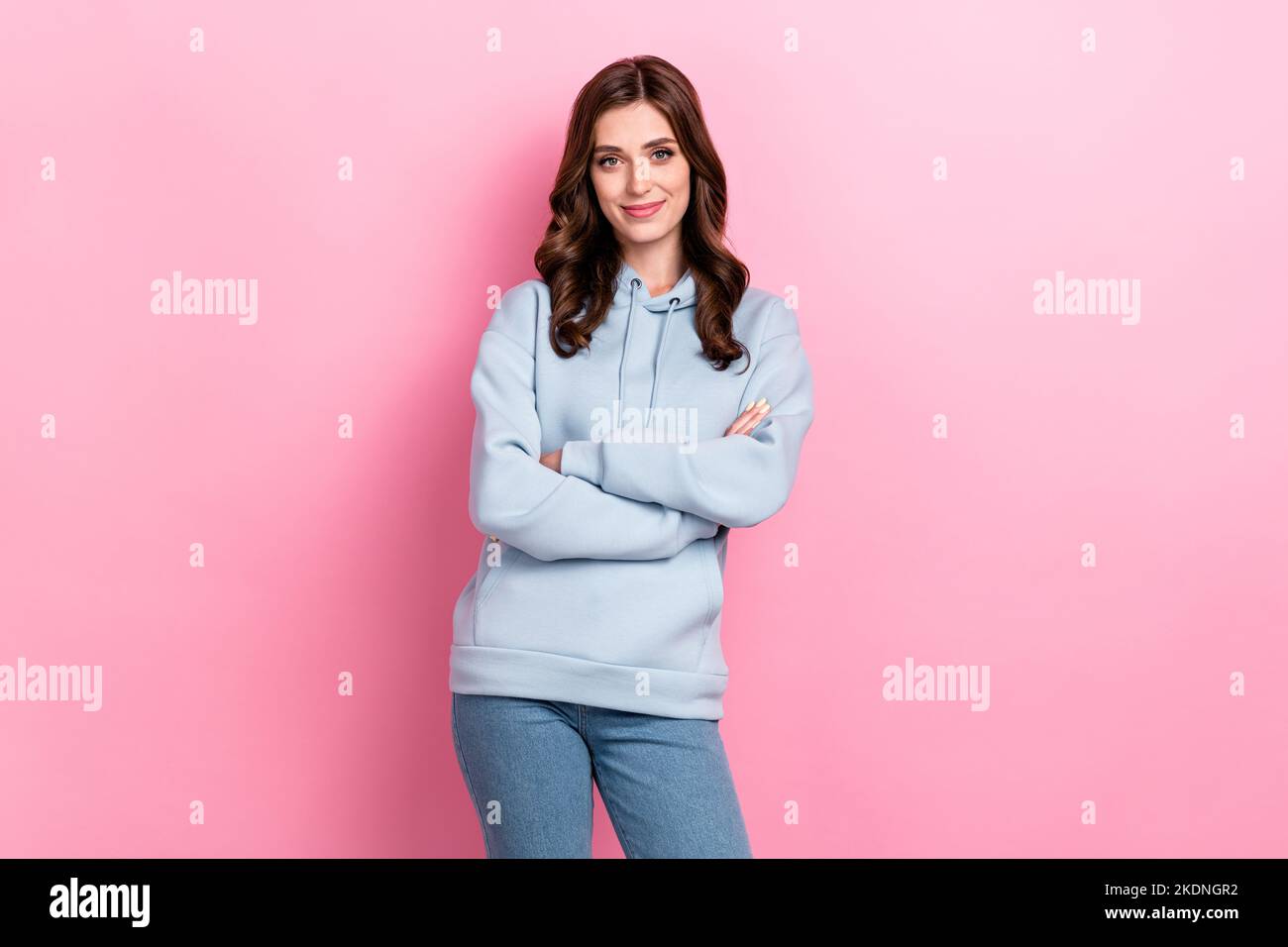 Photo of funny shiny young lady wear grey hoodie smiling arms folded ...