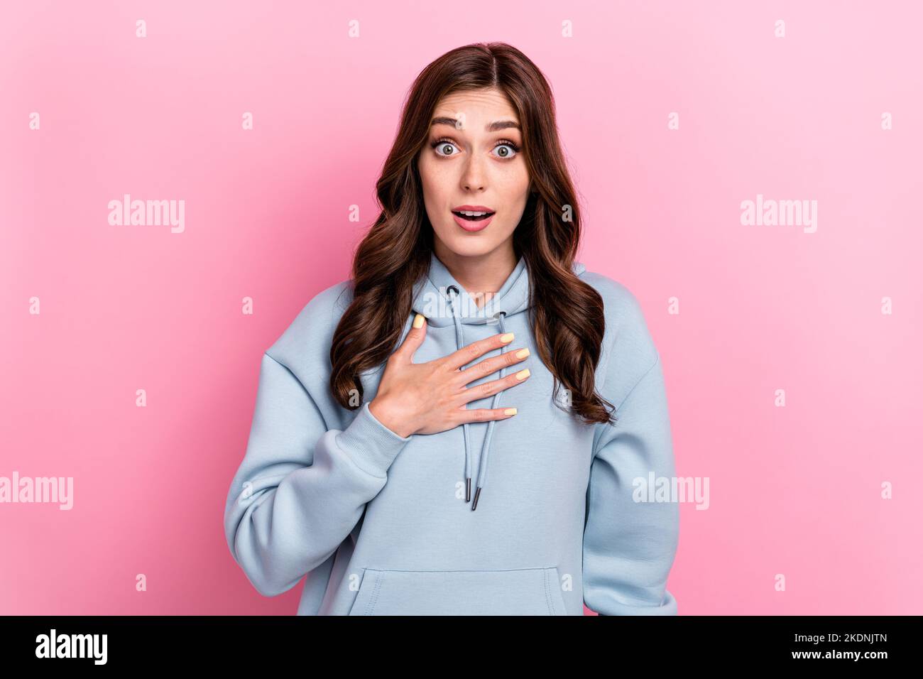 Photo of shocked young lady open mouth arm touch chest isolated on pink ...