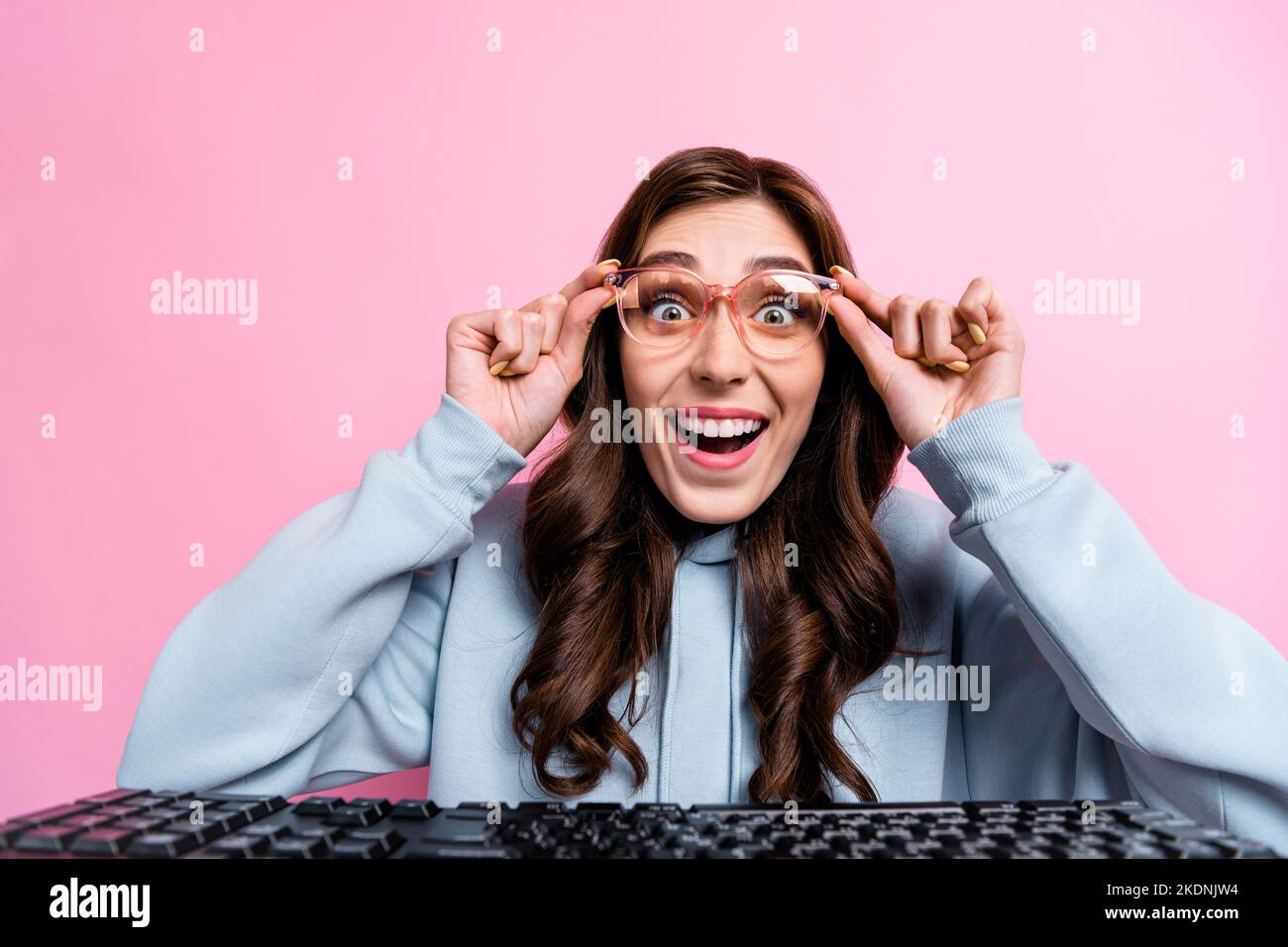 Photo of astonished overjoyed girl arms touch glasses toothy smile ...