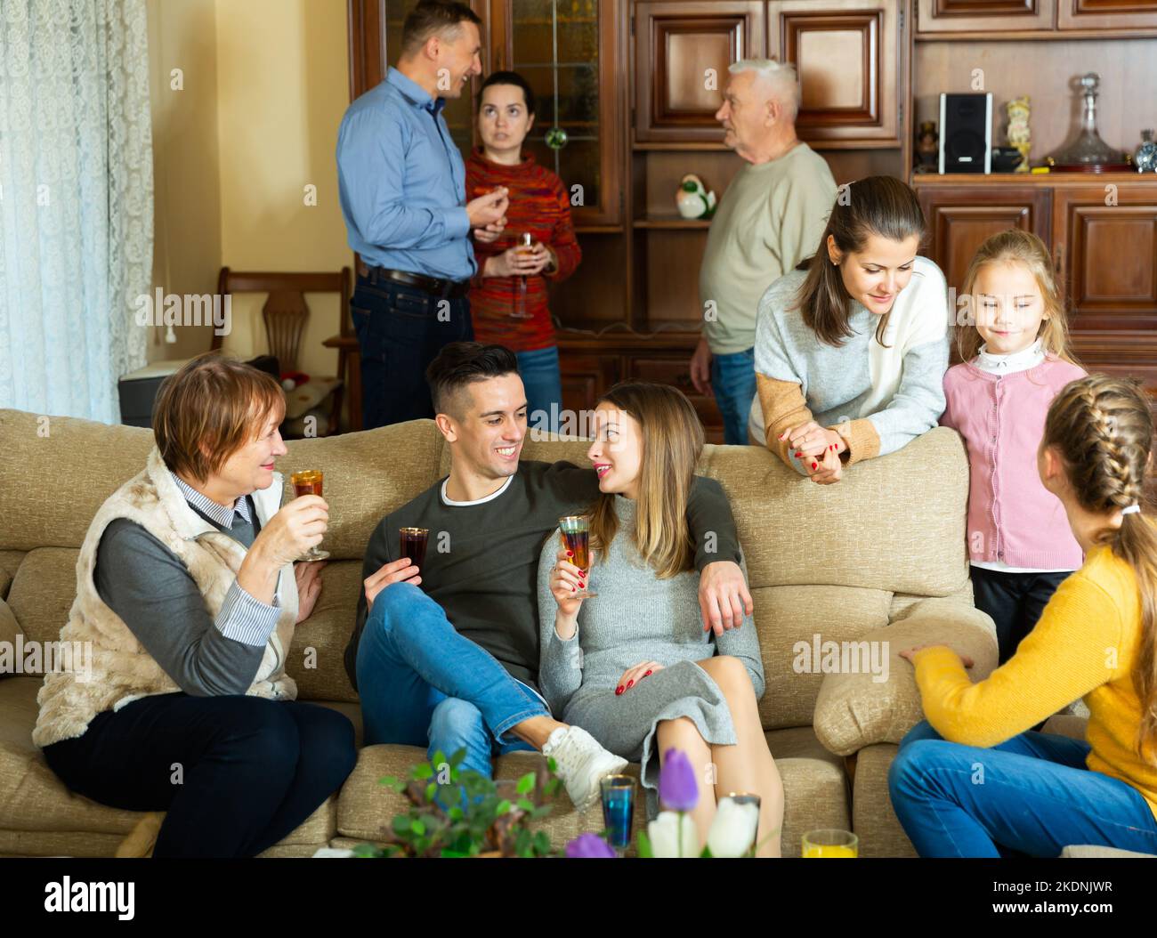 Friendly family in home interior Stock Photo - Alamy