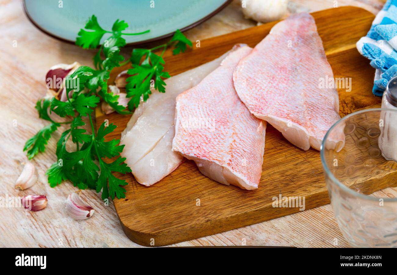 Fresh raw fillet of sea bass Stock Photo - Alamy