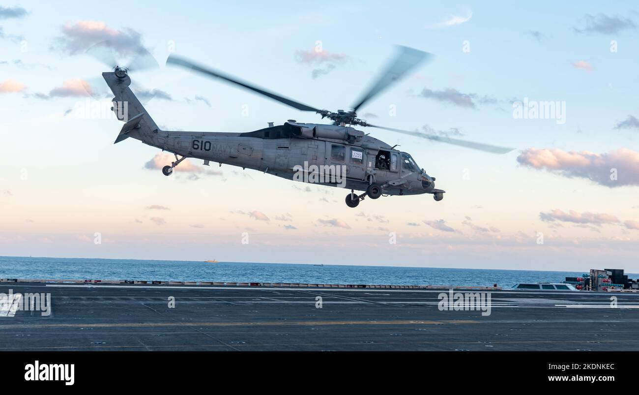 221106-N-DW158-1545 SAGAMI WAN (Nov. 6, 2022) An MH-60S Seahawk ...