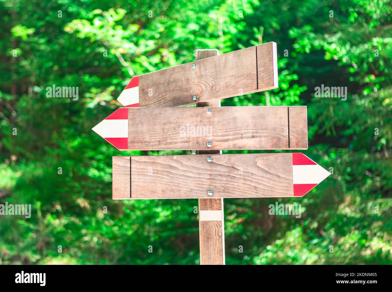 Wooden arrow boards . Wood arrow signs for tourists . Direction ...