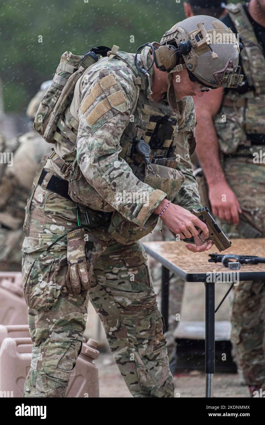 A U.S. Air Force Tactical Air Control Party (TACP) specialist fires his ...