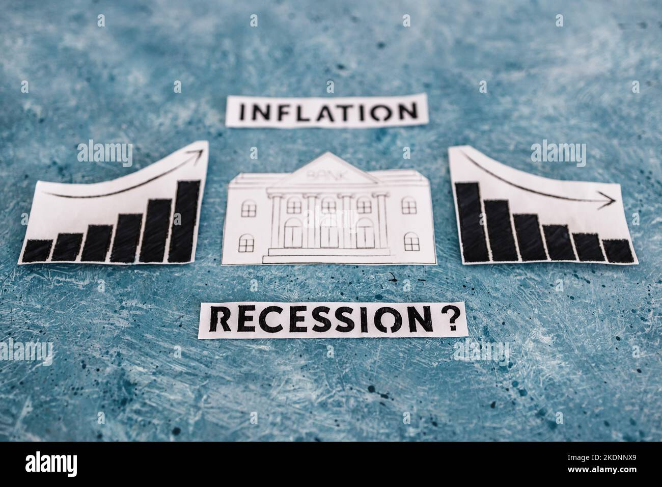 inflation and recession texts with bank icon in between graphs with ...