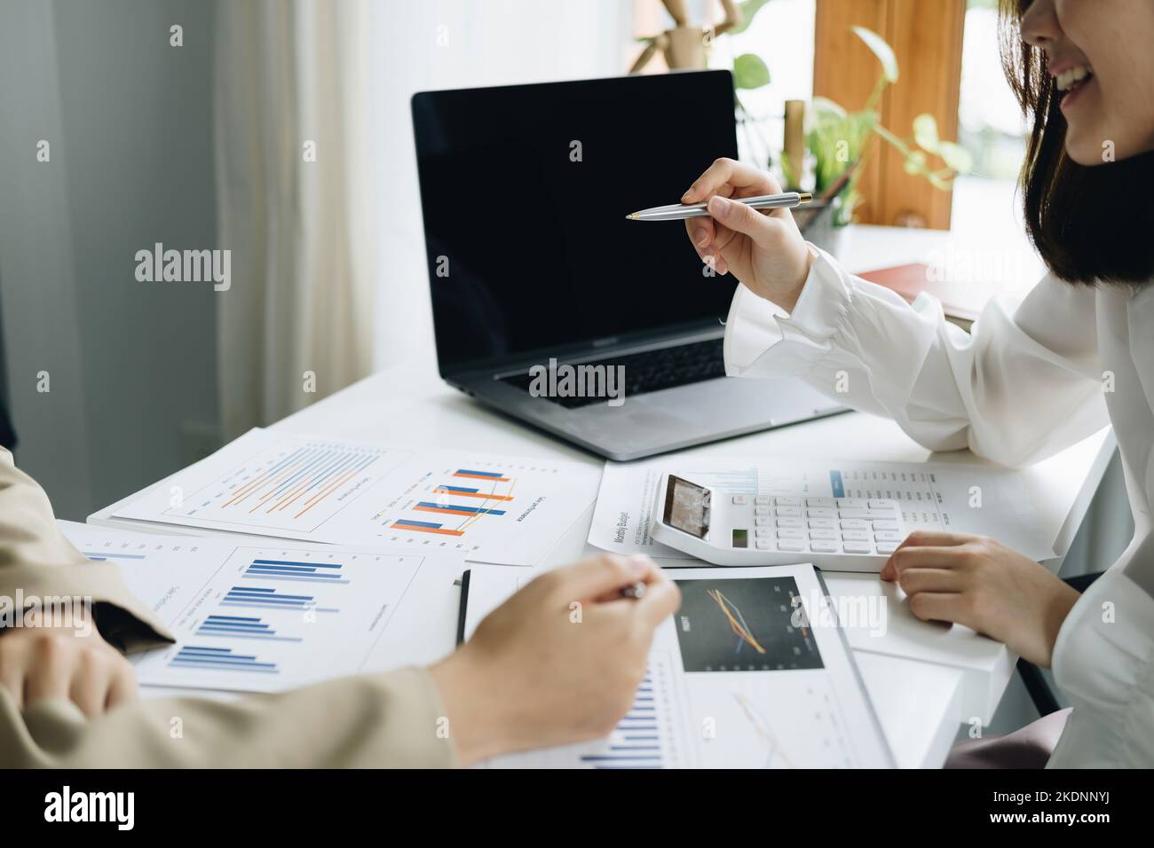 Negotiation, Analysis, Discussion, Asian woman economist and marketer ...