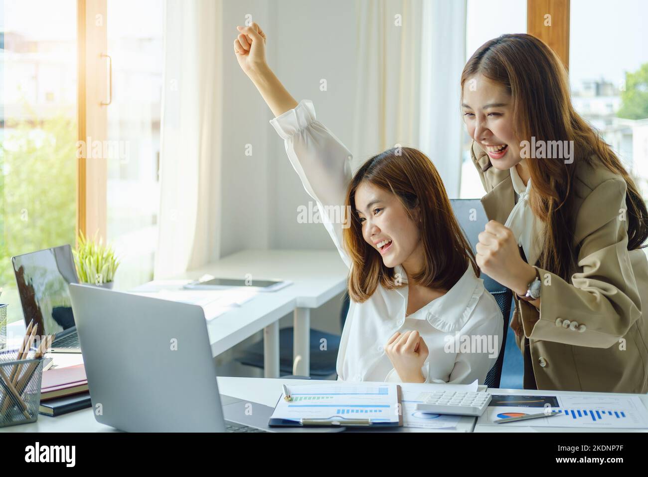startup, successful, portrait of two young Asian women working on ...