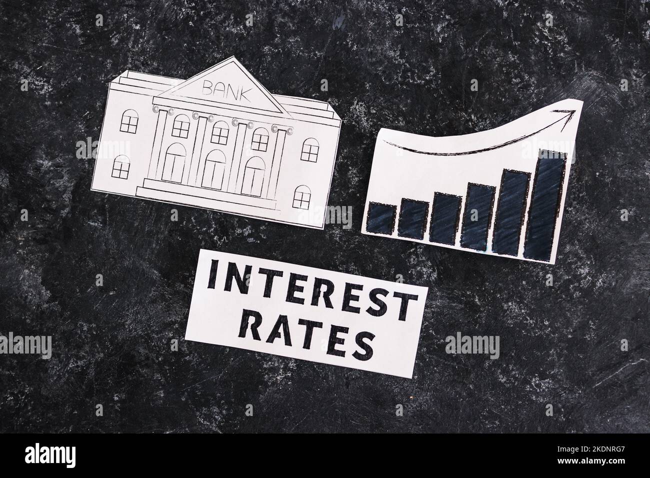 interest rates text with bank icon next to graph with stats going up ...