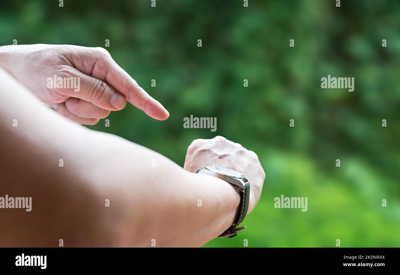 Man pointing his finger to his watch. It's time or hurry concept Stock ...
