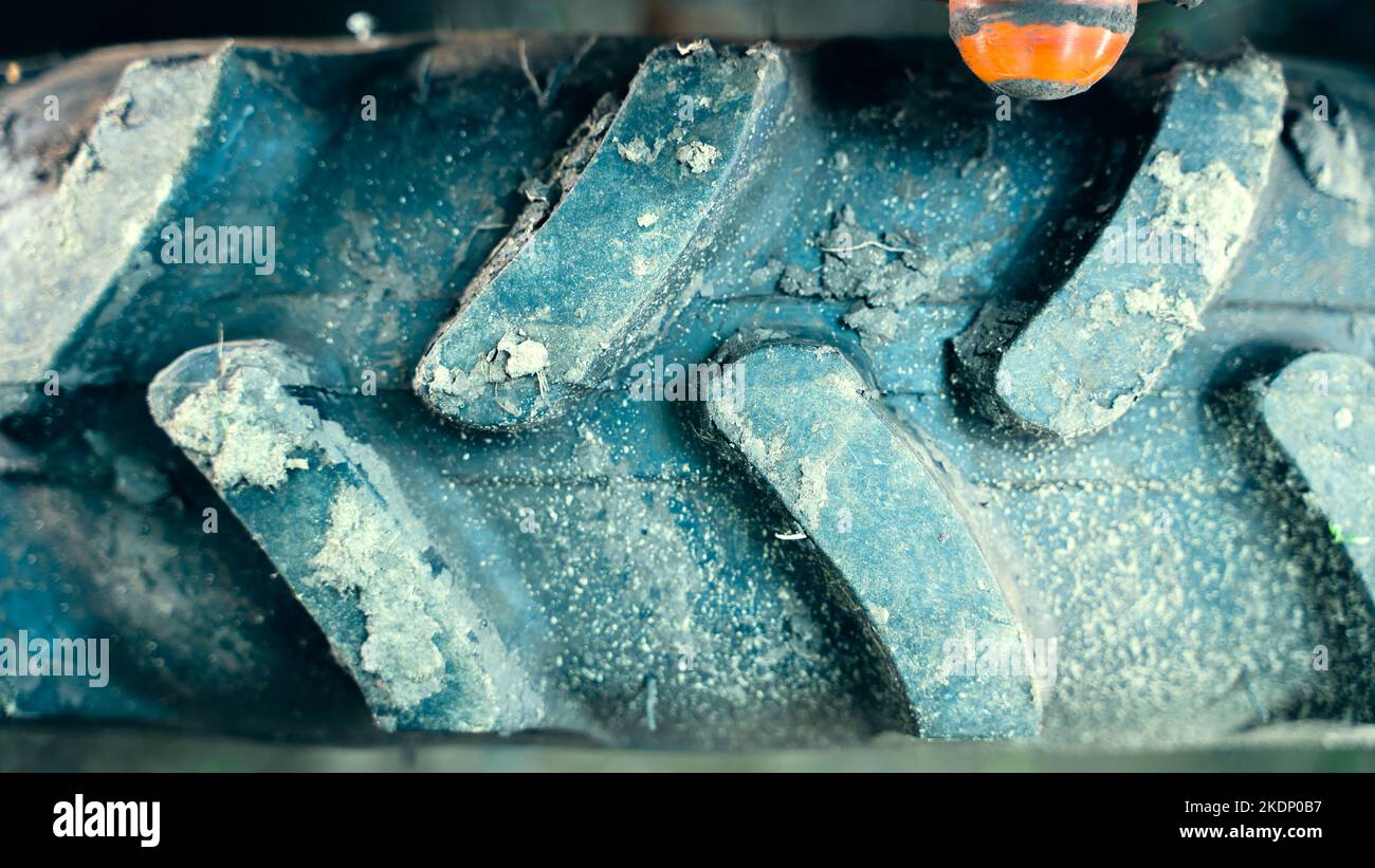 Volumetric rubber tread on a tractor wheel close-up. Mud tread pattern ...
