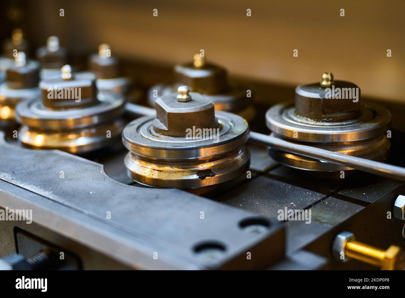 Metal wire pulled out through machine tool rollers at plant Stock Photo ...