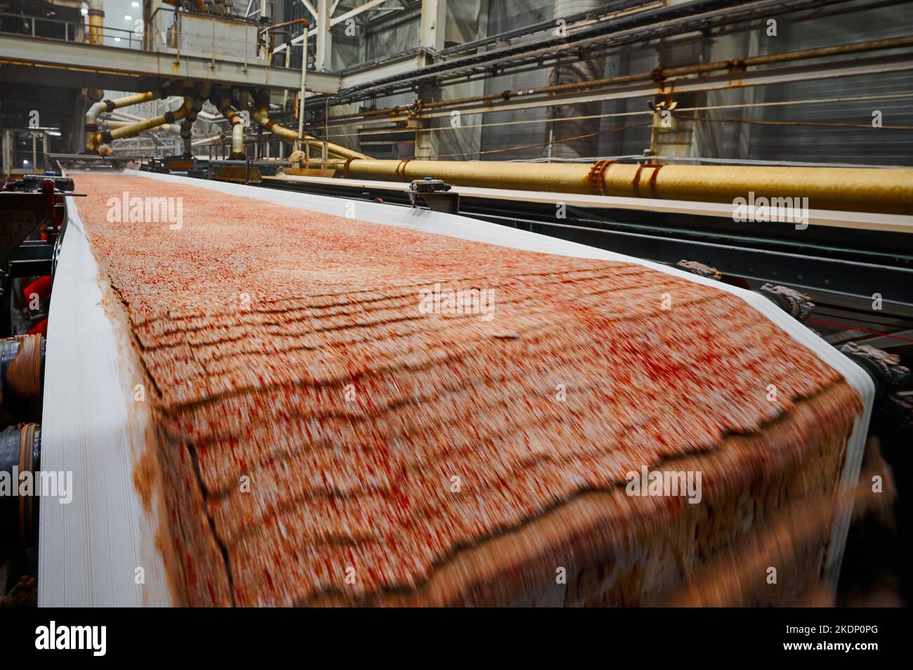 Colorful mineral salt material transported by conveyor belt Stock Photo ...