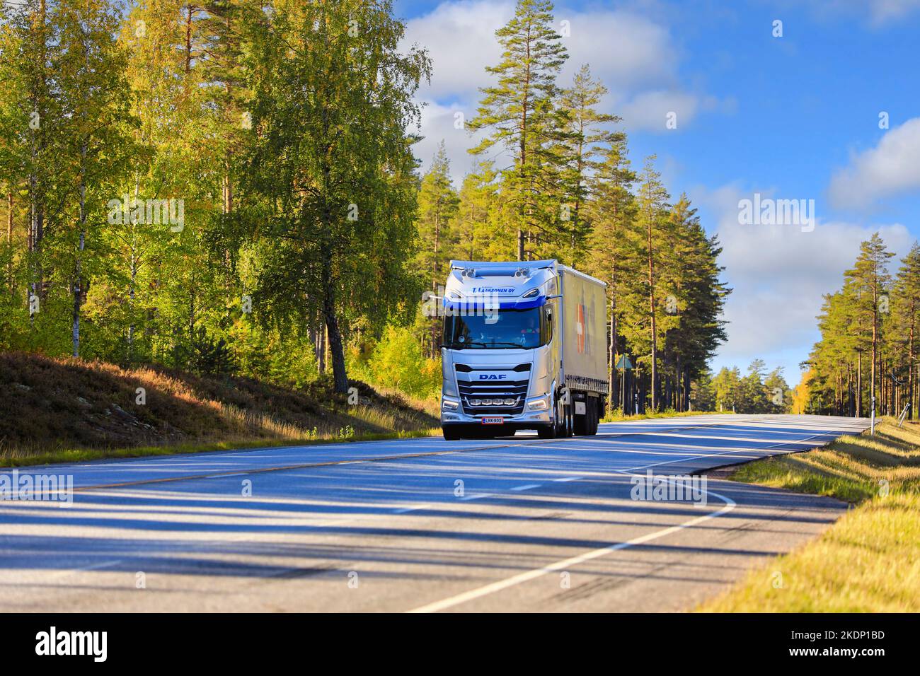 Autumnal road landscape with new silver DAF XG+ 530 truck semi trailer ...