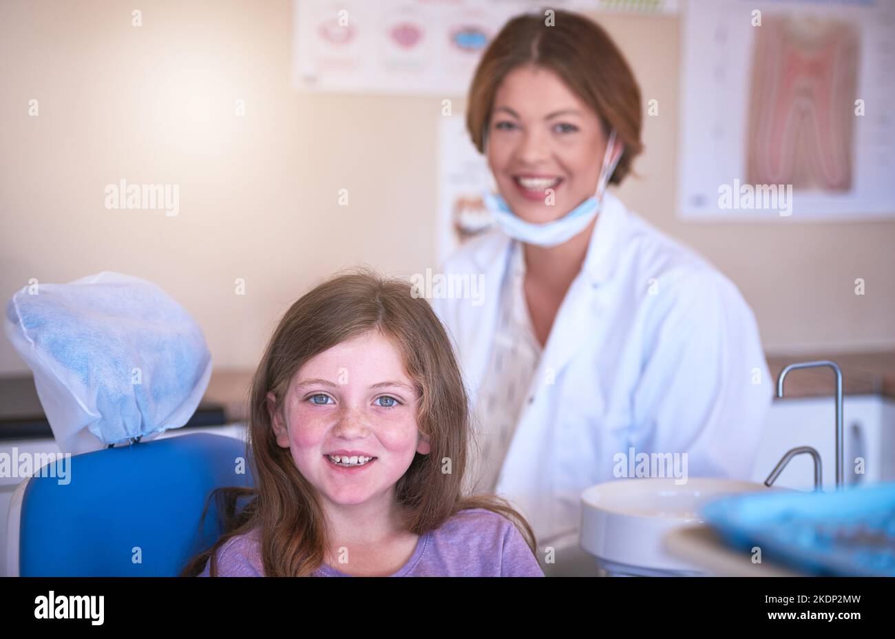 Visiting for her 6 month check-up. a little girl at the dentist for a ...