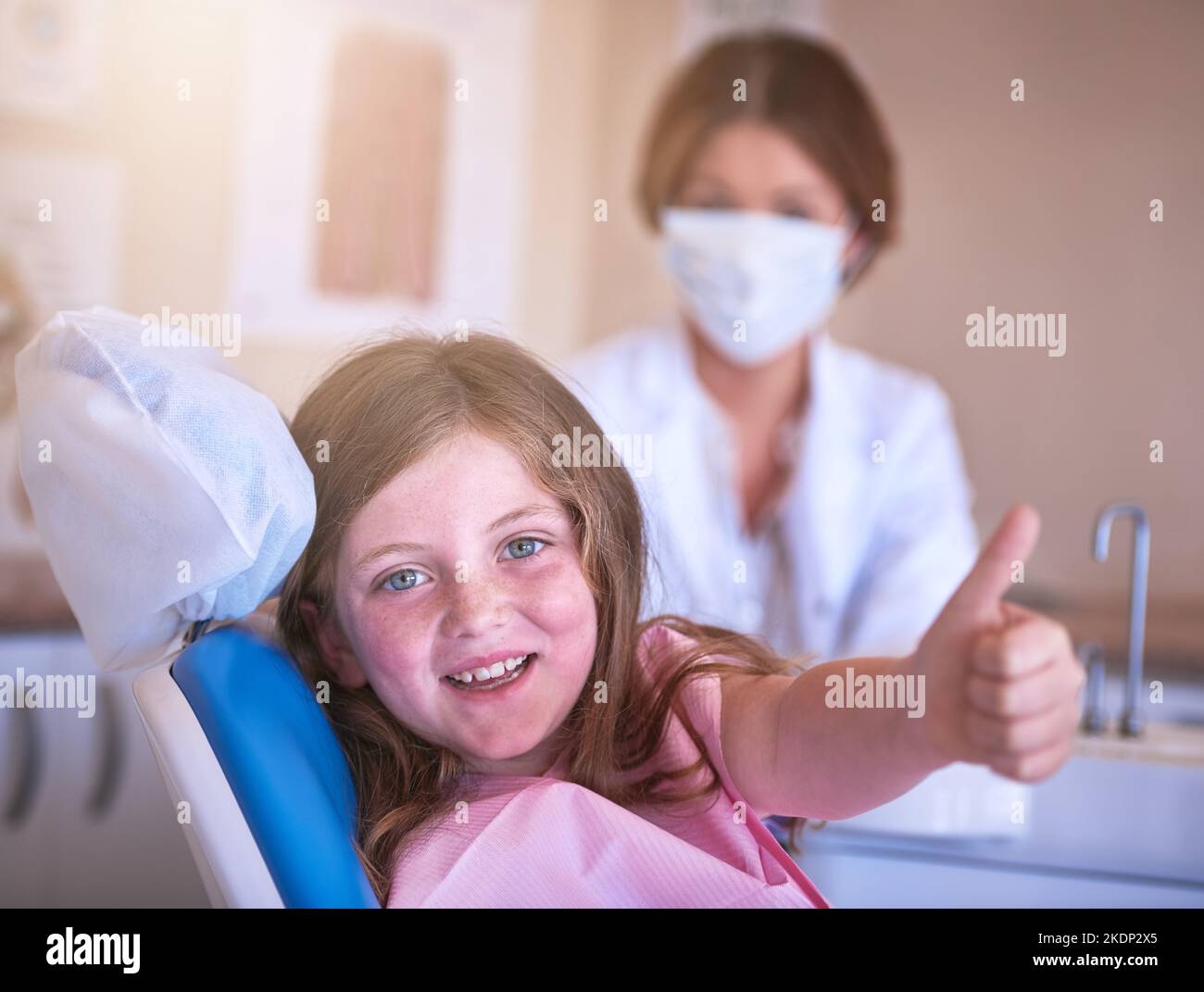 Ready for her first dental examination. a little girl at the dentist for a checkup Stock Photo ...