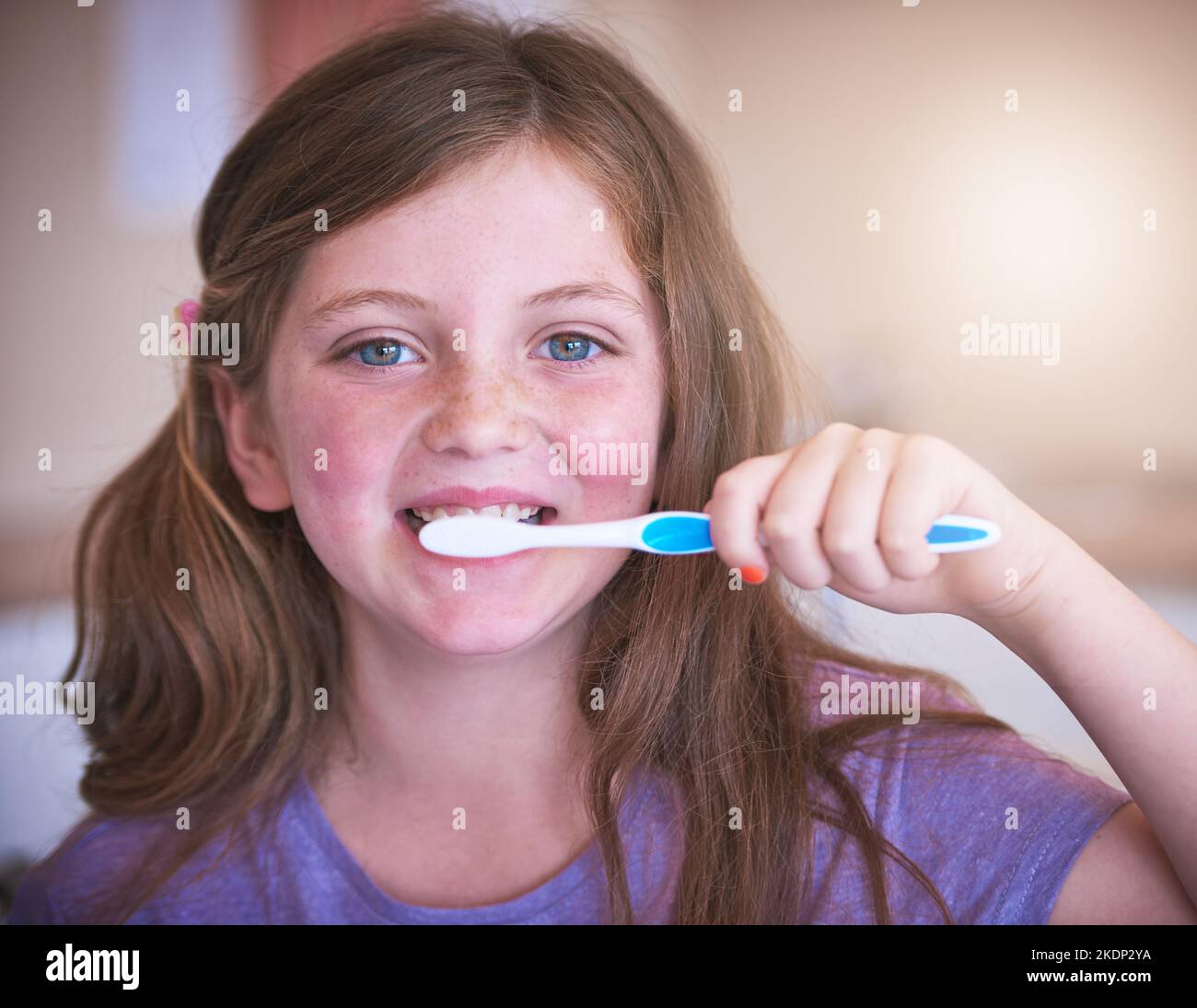 Keeping my teeth in tip-top shape. a little girl brushing her teeth ...