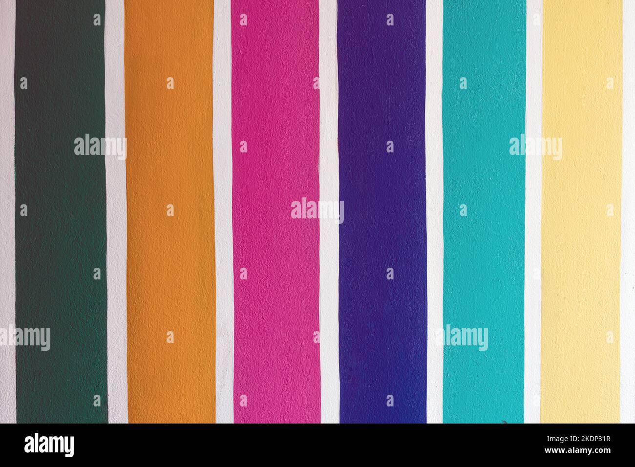 Multicolor vertical striped pattern on cement wall. Colorful painted on ...