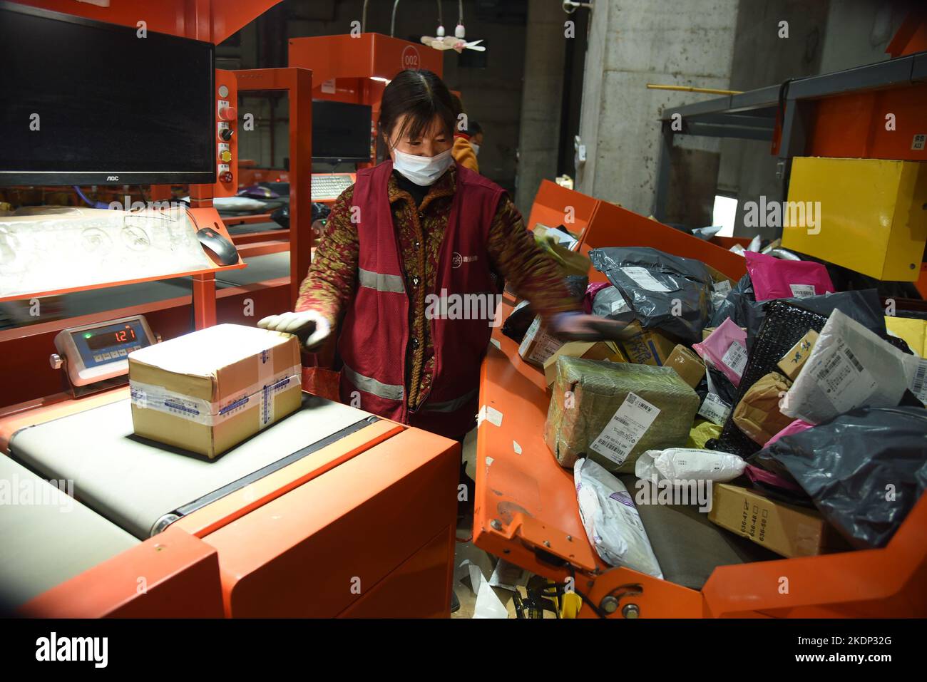 LIANYUNGANG, CHINA - NOVEMBER 8, 2022 - Employees of YTO Express sort ...