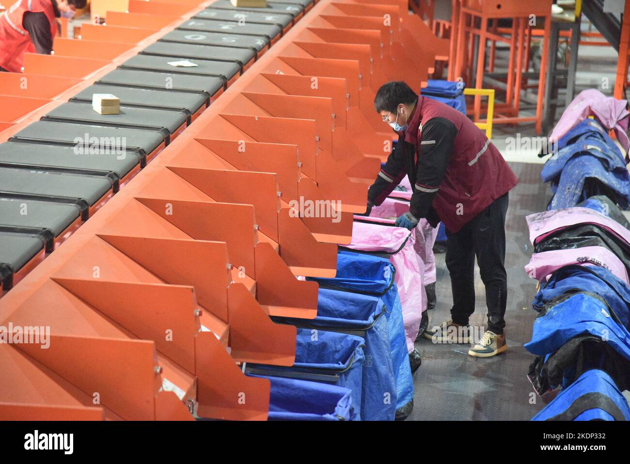 LIANYUNGANG, CHINA - NOVEMBER 8, 2022 - Employees of YTO Express sort ...